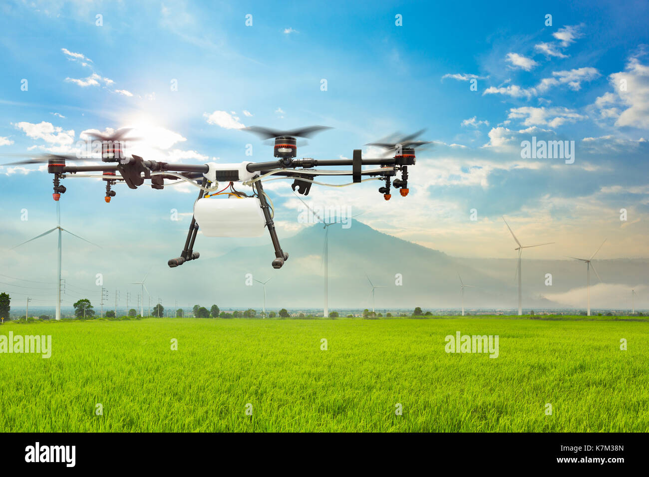 Agriculture drone flying on the green rice field Stock Photo - Alamy