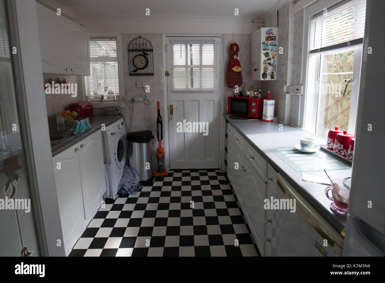 General view of the kitchen of a post WW2 pre-fabricated home, one of ...