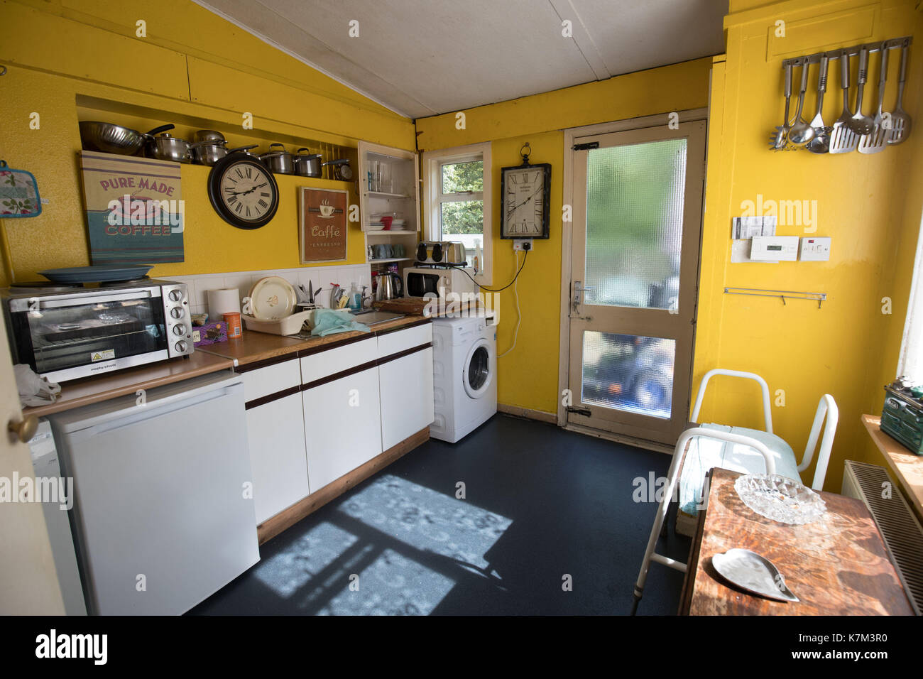 General view of the kitchen of a post WW2 pre-fabricated home, one of ...