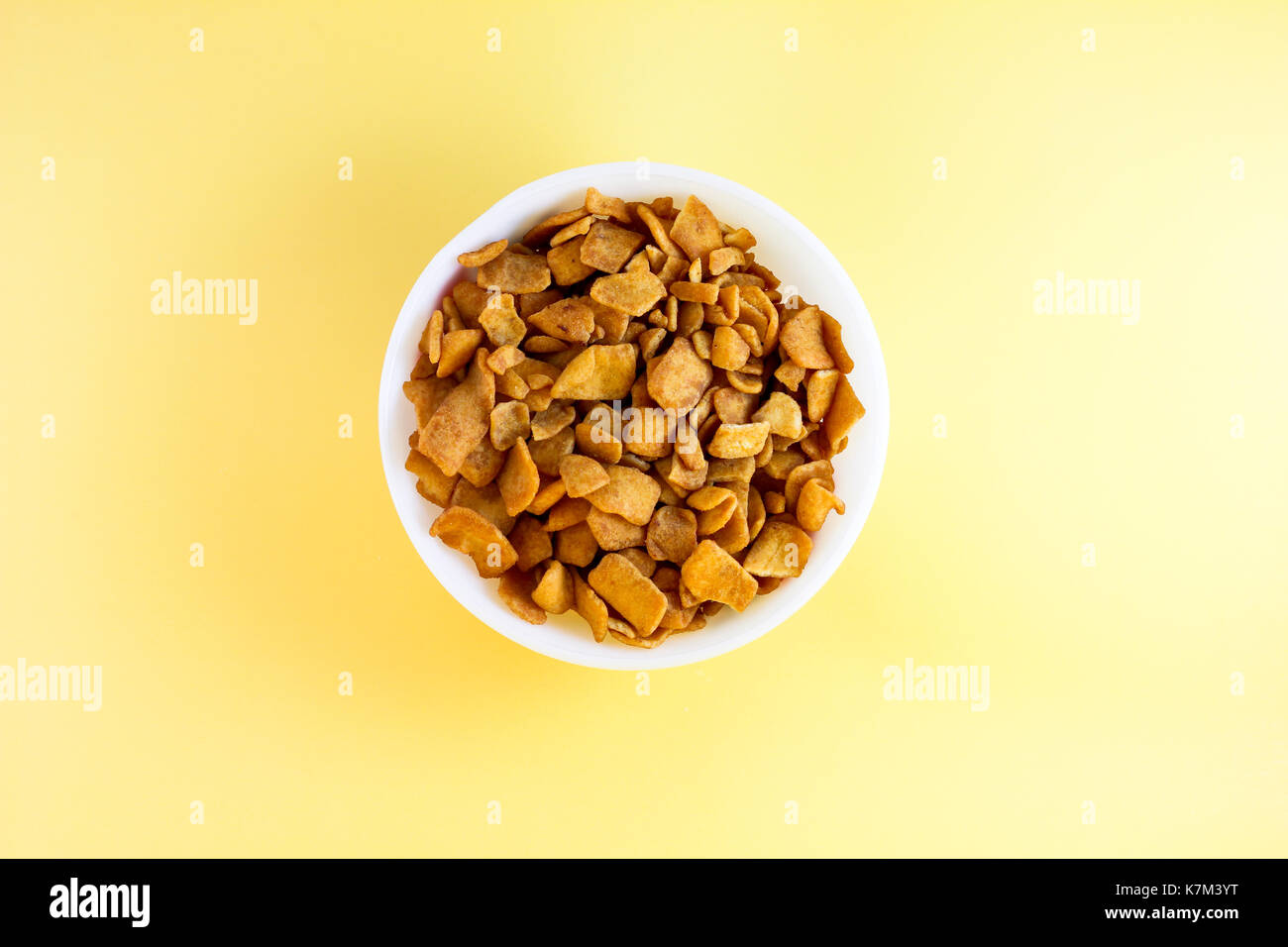 Traditional Indian Snacks on white bowl on yellow background Stock ...