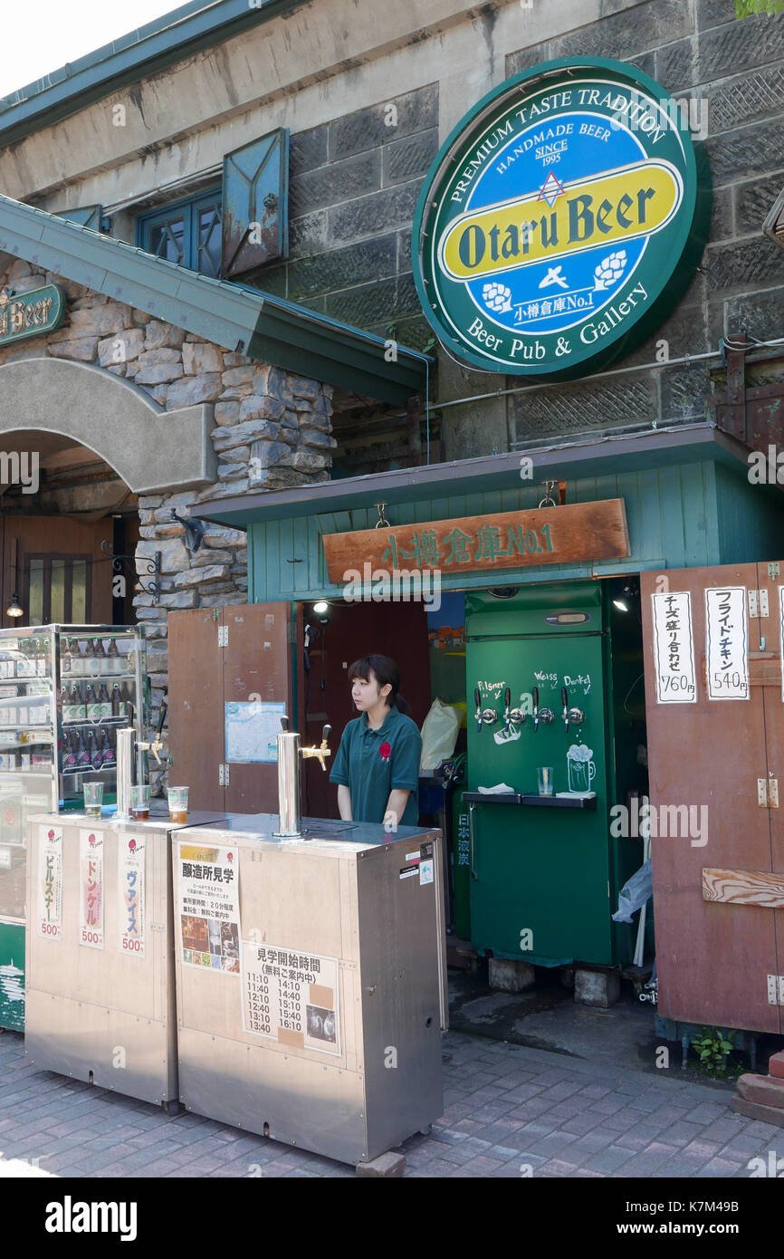 Otaru Beer brewery and restaurant. Wide shot of waitress behind outdoor ...