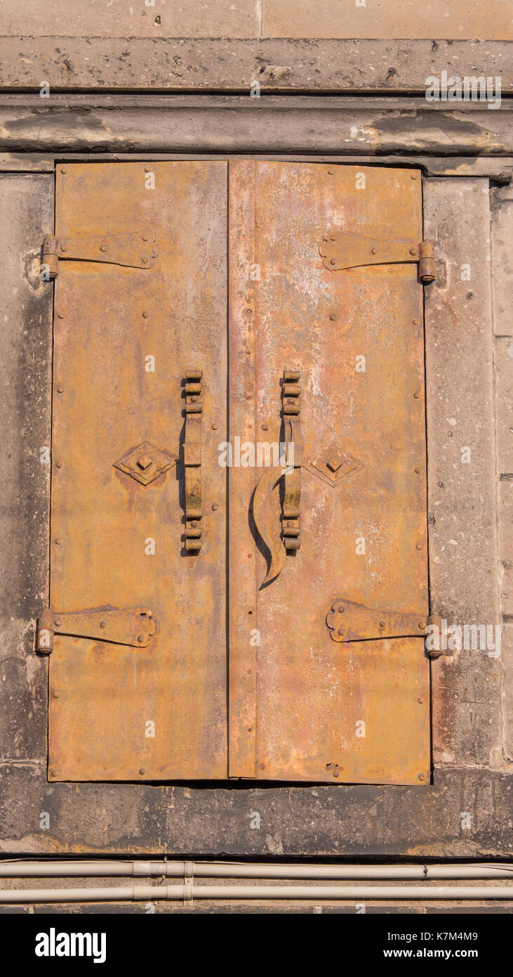 Traditional, rusted metal doors on traditional concrete Japanese ...