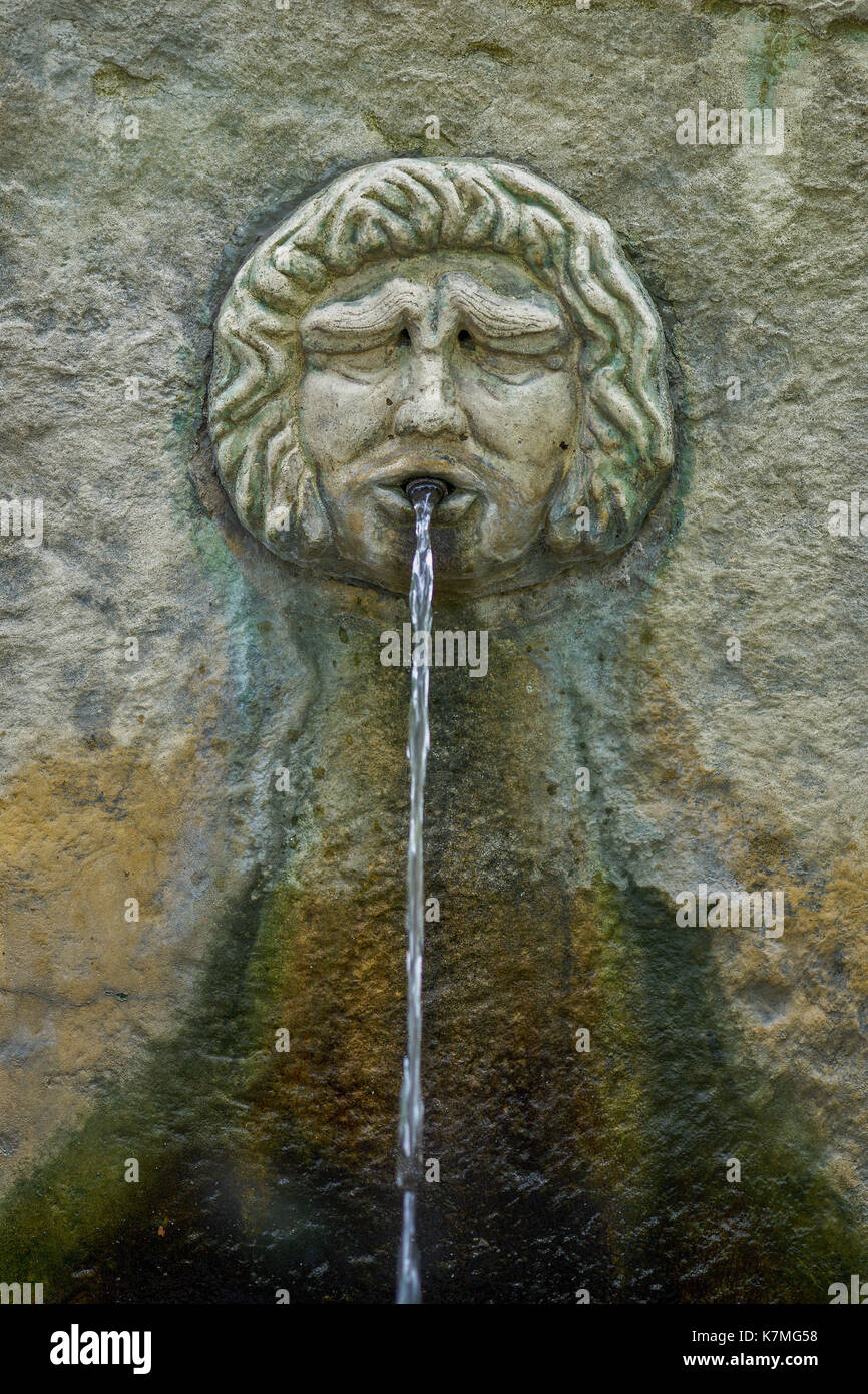 Fountain with the image of the suffering face hi-res stock photography ...