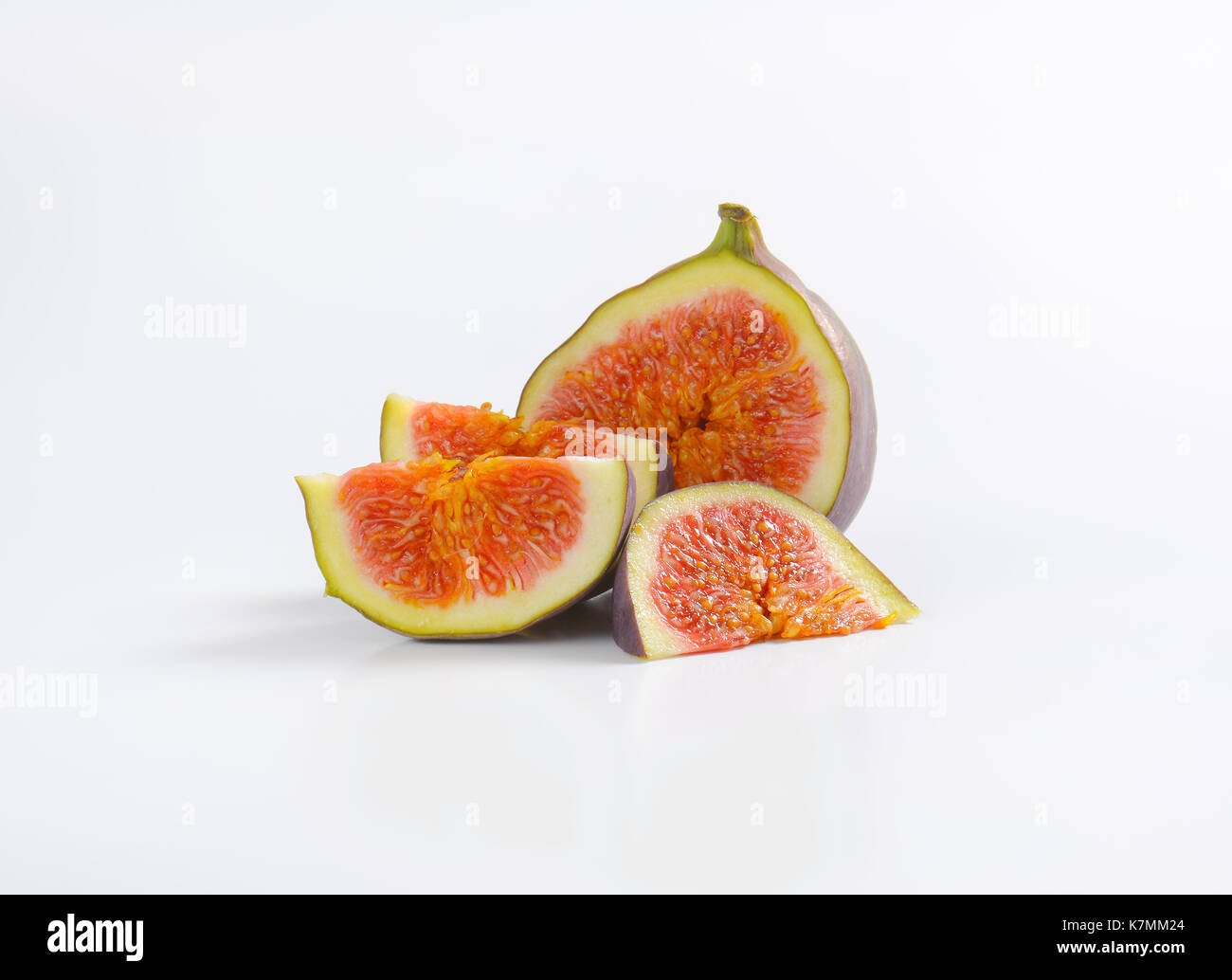 fresh sliced fig on white background Stock Photo - Alamy