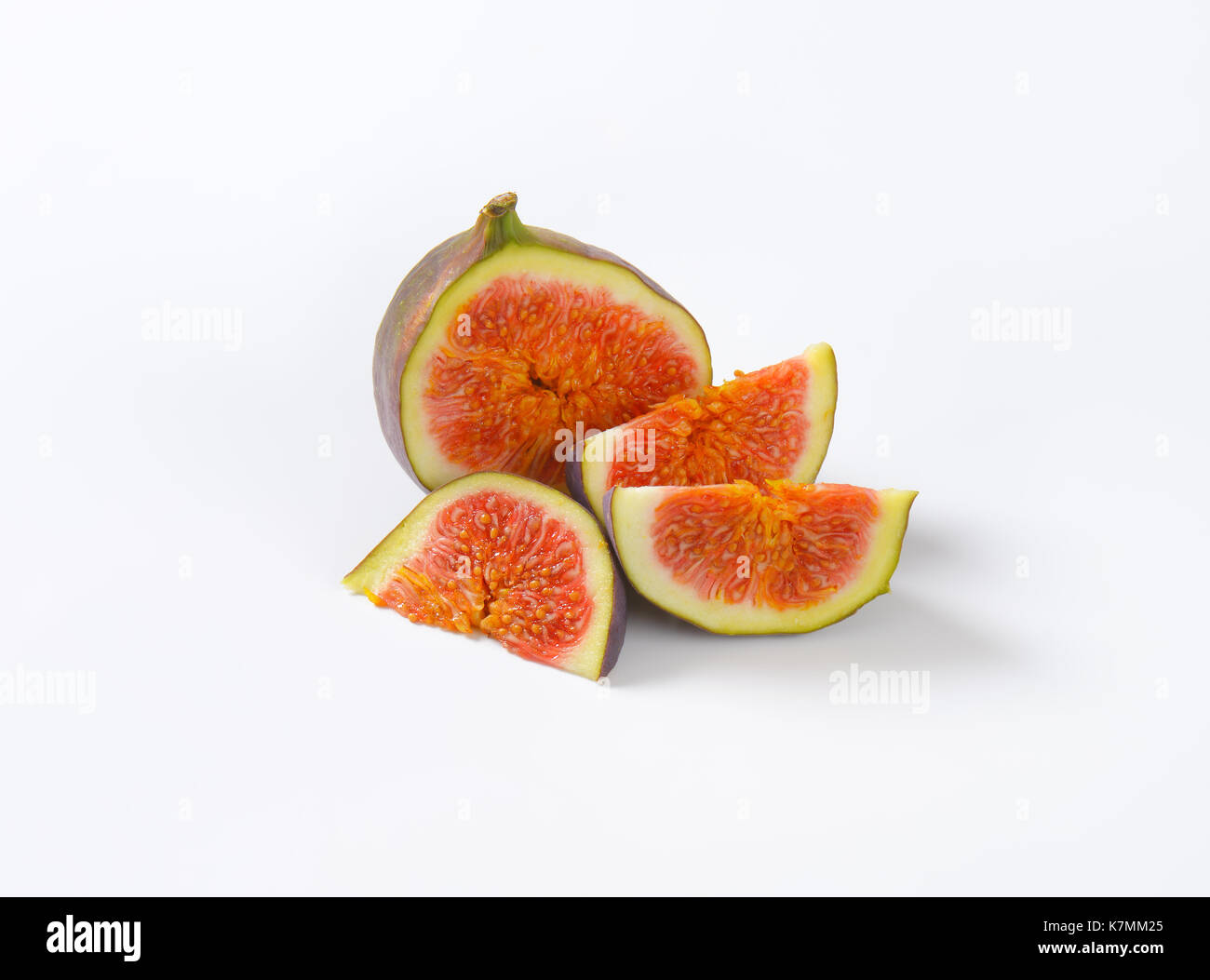 fresh sliced fig on white background Stock Photo - Alamy