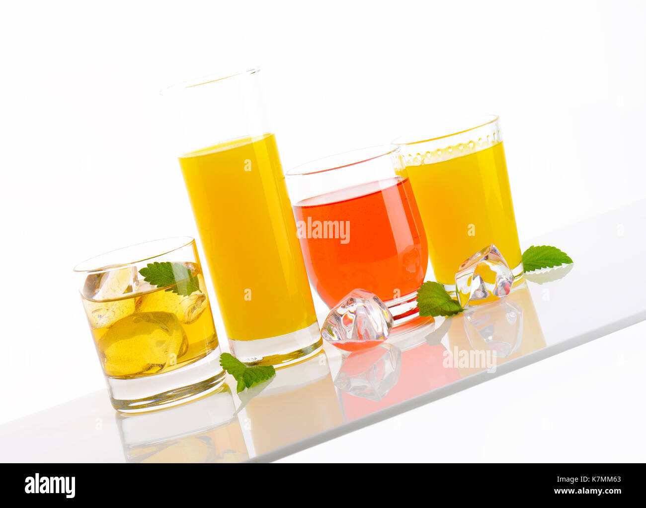 variety of fresh fruit juices on white background Stock Photo - Alamy
