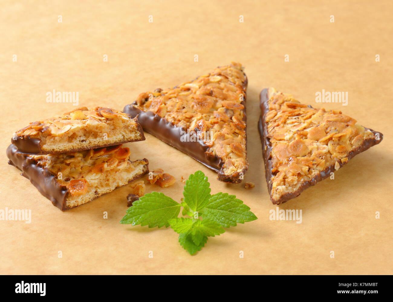 Triangle nut bars dipped in chocolate Stock Photo - Alamy