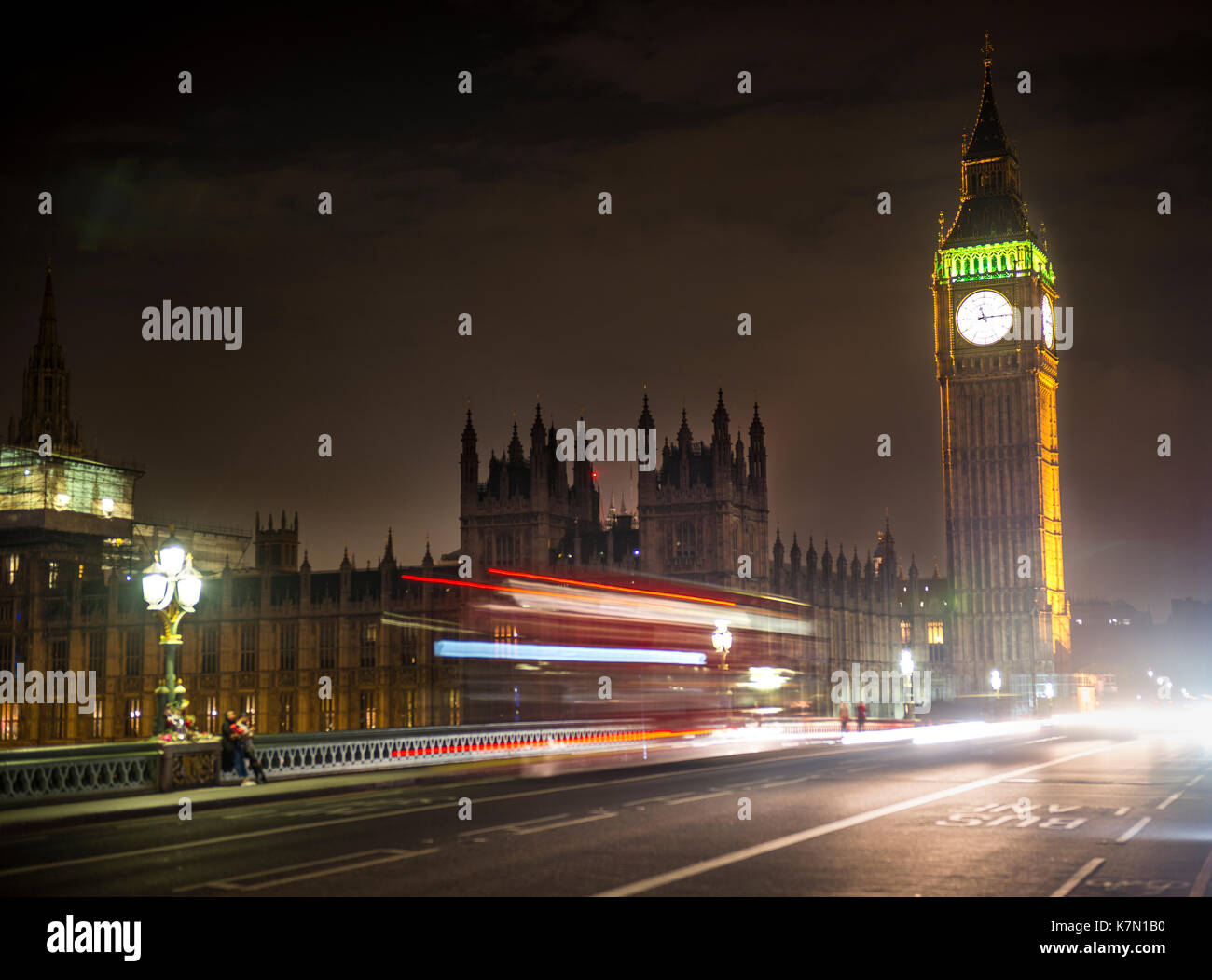 Palace of Westminster with Big Ben at night, red double-decker bus on ...