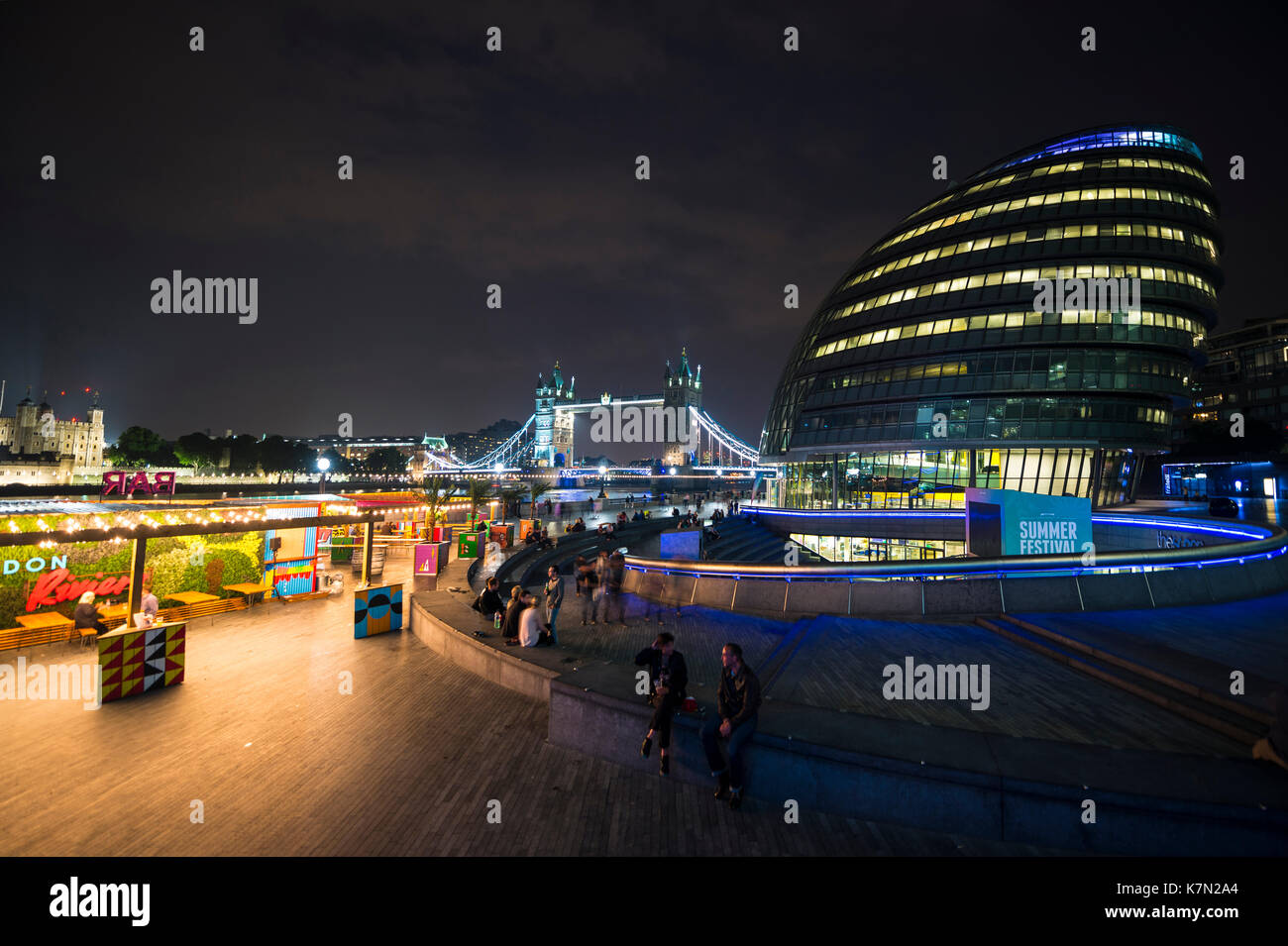 Shore promenade at night, London City Hall, More London Riverside, at ...
