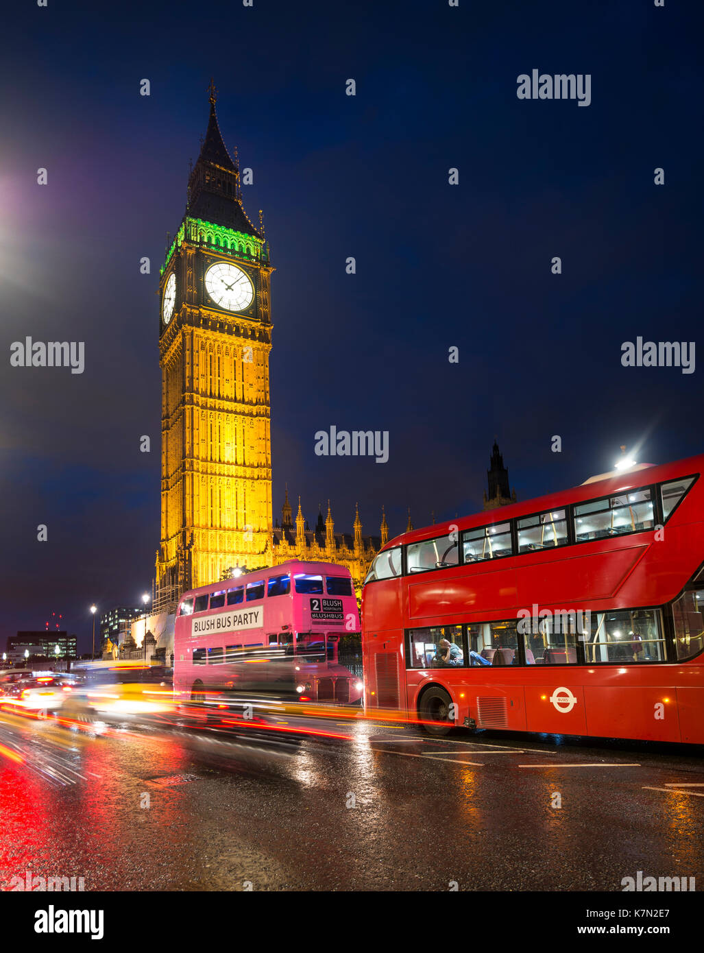Red double-decker buses in front of Big Ben, Houses of Parliament ...