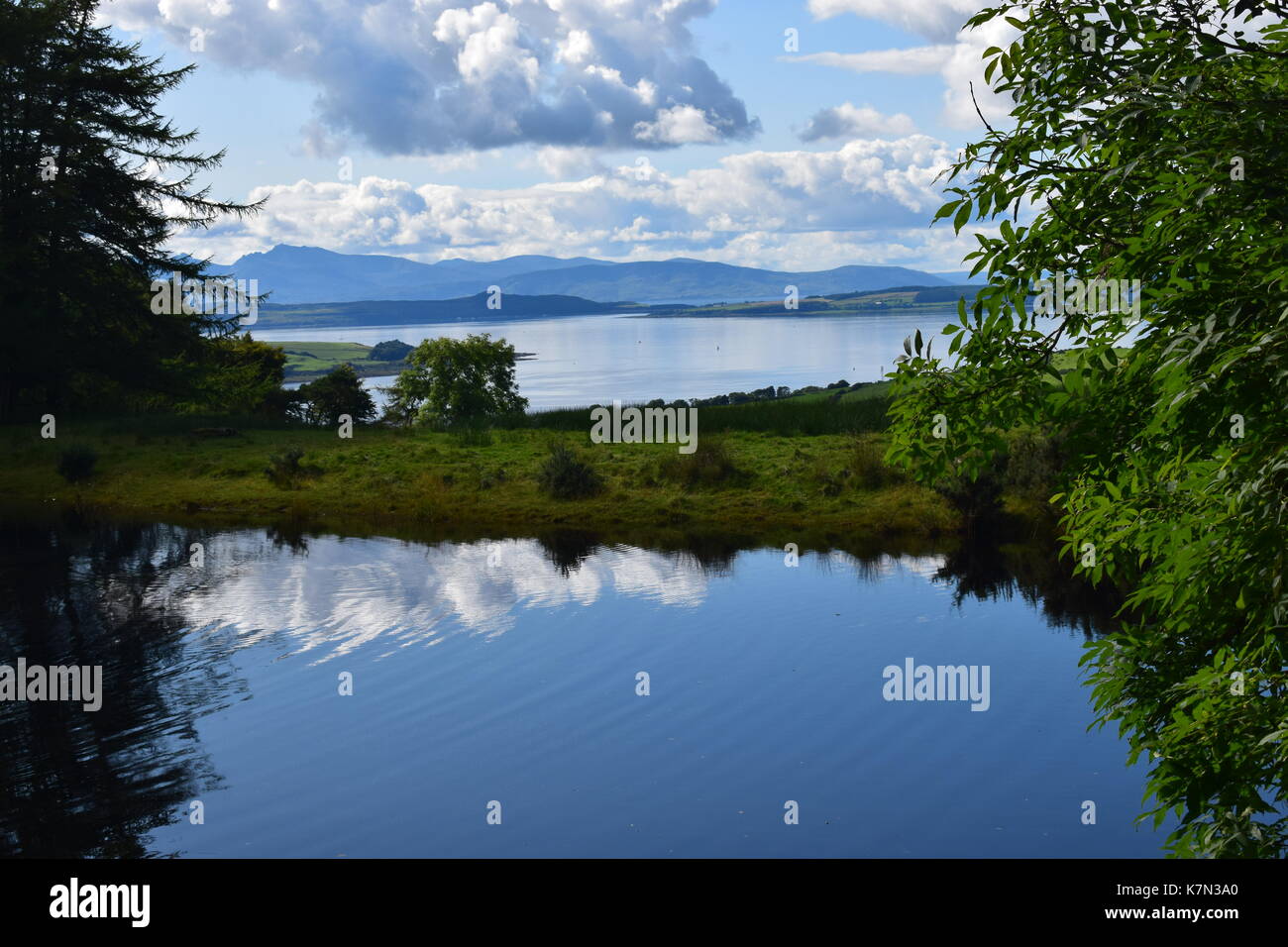Serene lakeside view trees hills hi-res stock photography and images ...