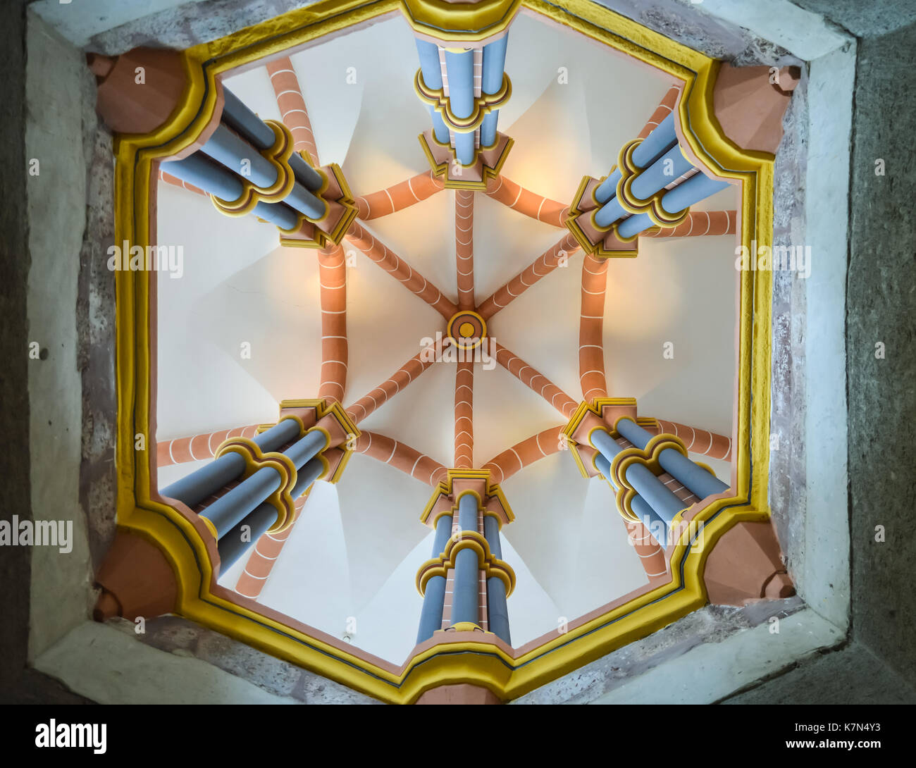 Arch-shaped vault with five blue pillars and red bricks in a Luxem ...