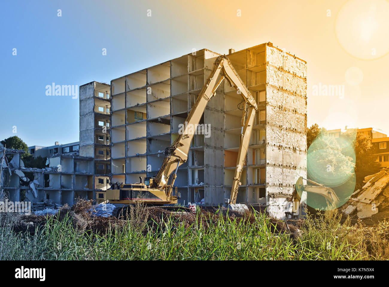 Construction site with demolished residential building being torn down ...