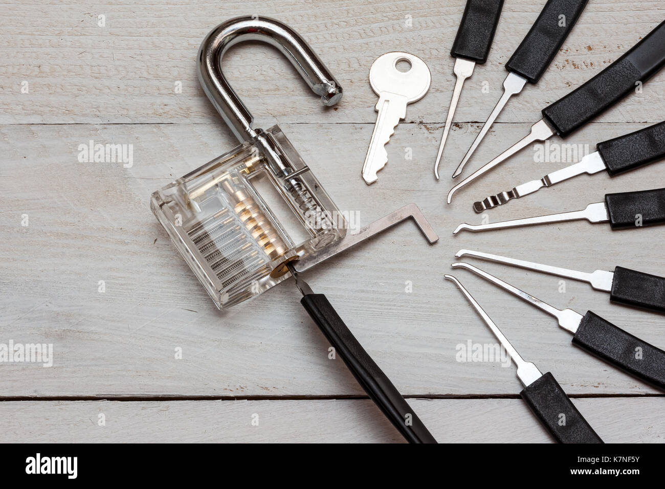 several lockpicking to open a lock on a door Stock Photo - Alamy