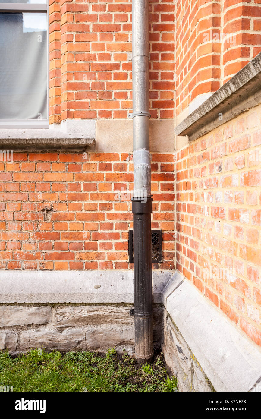 an rain drain pipe on an wall Stock Photo - Alamy
