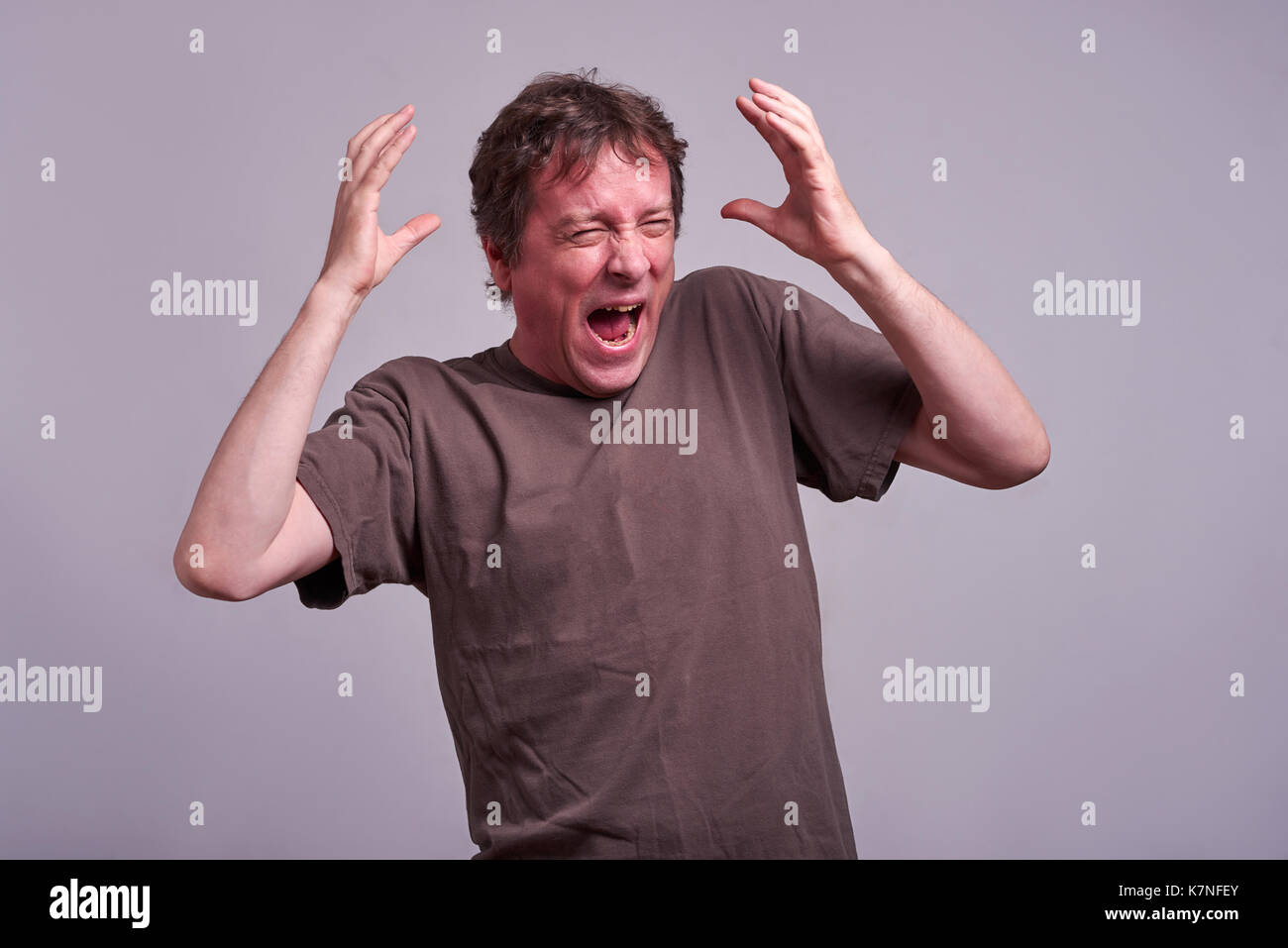 Middle aged man standing screaming hi-res stock photography and images ...