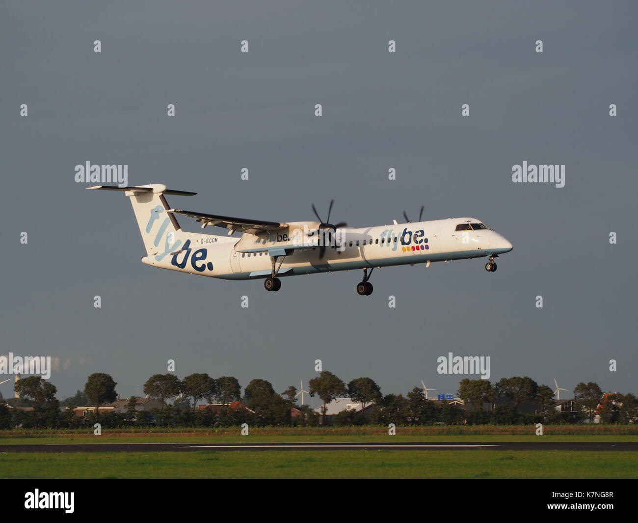 G-ECOM is a Flybe De Havilland Canada DHC-8-402Q Dash 8 aircraft landing on runway 18R at ...