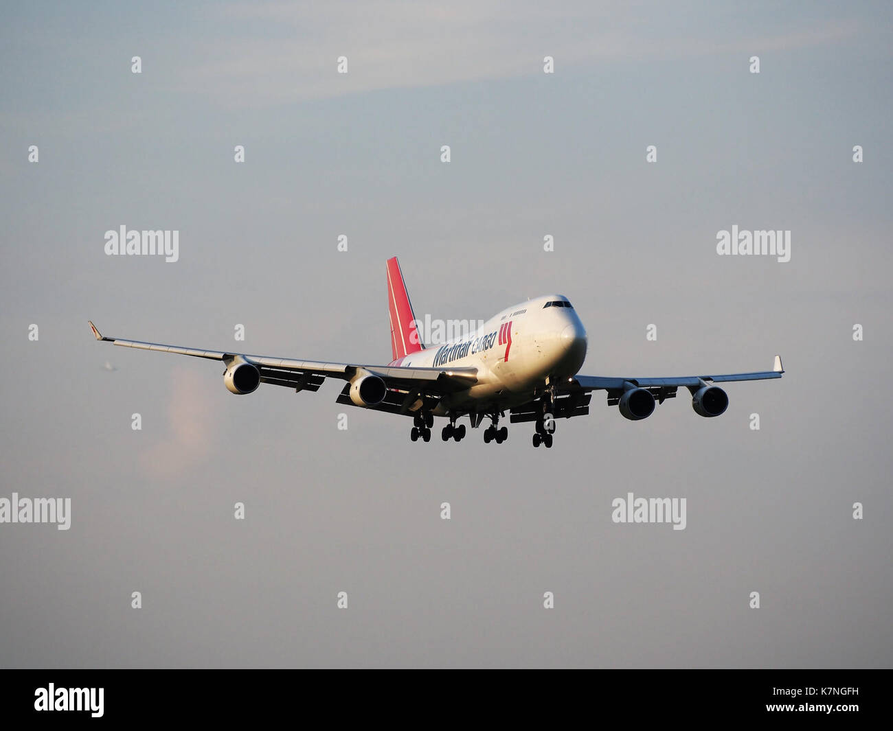 A photograph capturing a Martinair Holland Boeing 747-412(BCF) landing ...