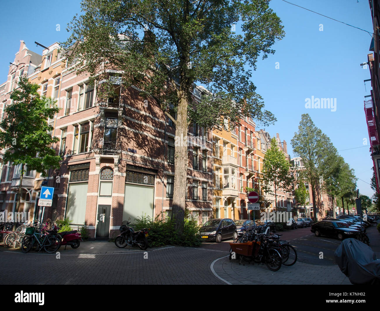 This image depicts a street corner in Amsterdam, at the intersection of ...