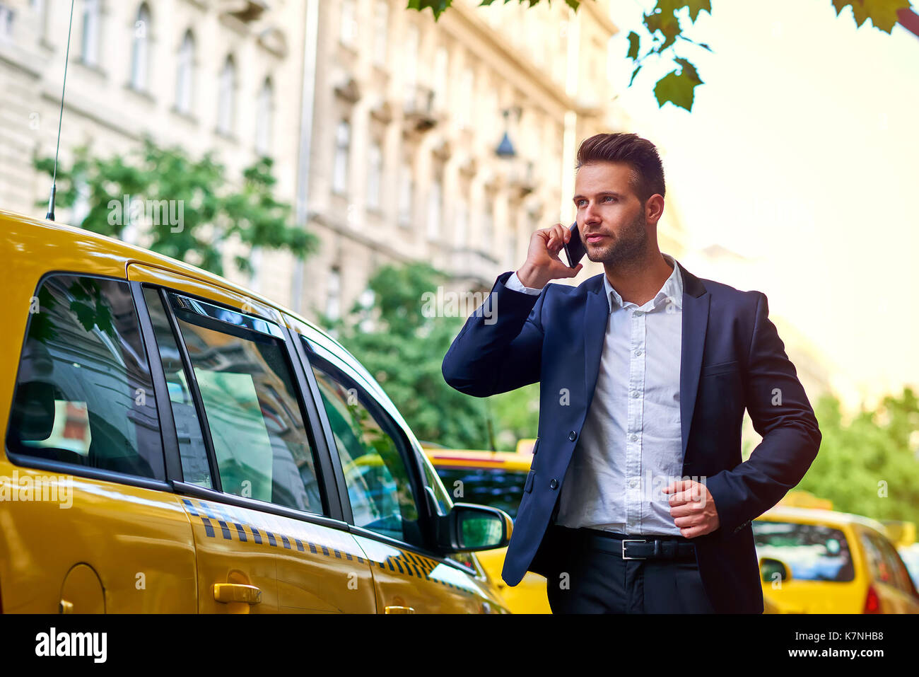 Businessman waiting for cab hi-res stock photography and images - Alamy