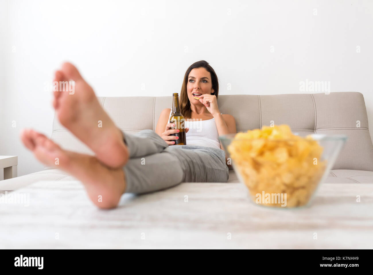 Woman Couch Potato High Resolution Stock Photography and Images - Alamy