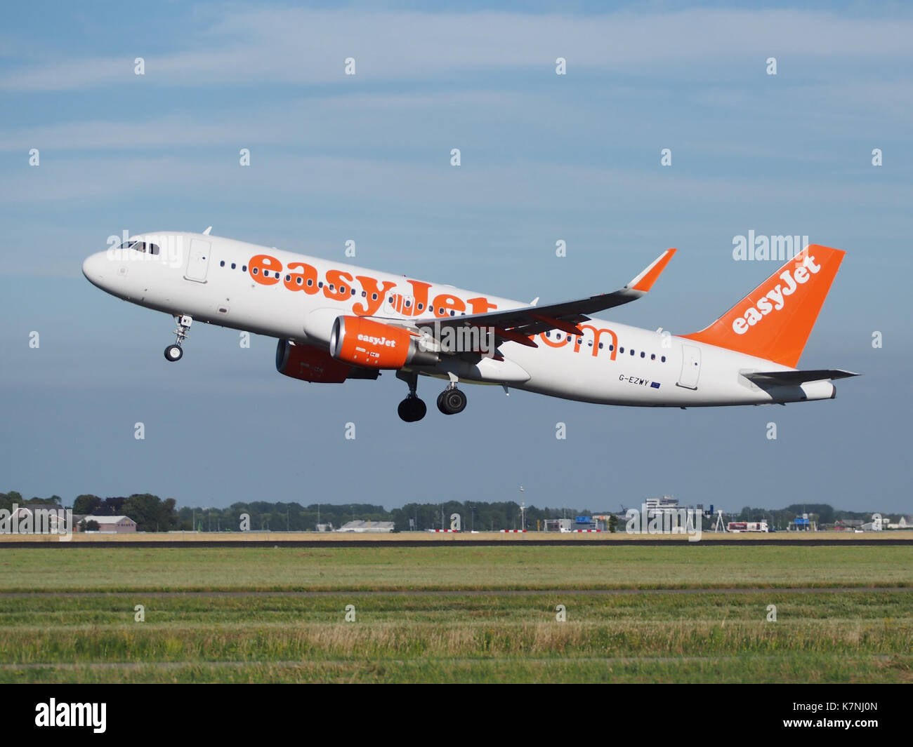 This photograph shows an easyJet Airbus A320-214(WL) taking off from ...