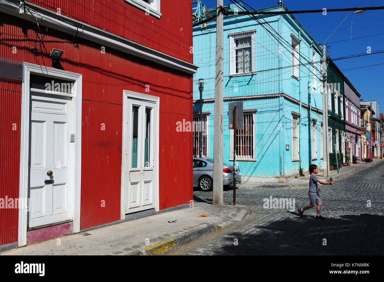 A child playing on a colourful street in Valparaiso, Chile Stock Photo ...