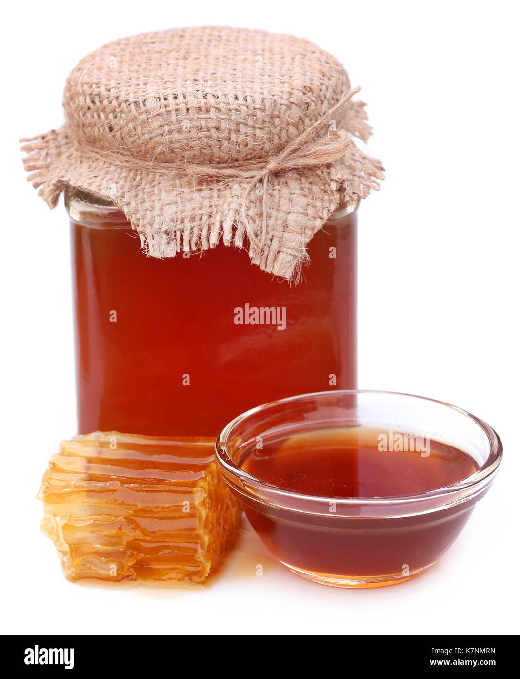 Honey with beehive over white background Stock Photo - Alamy