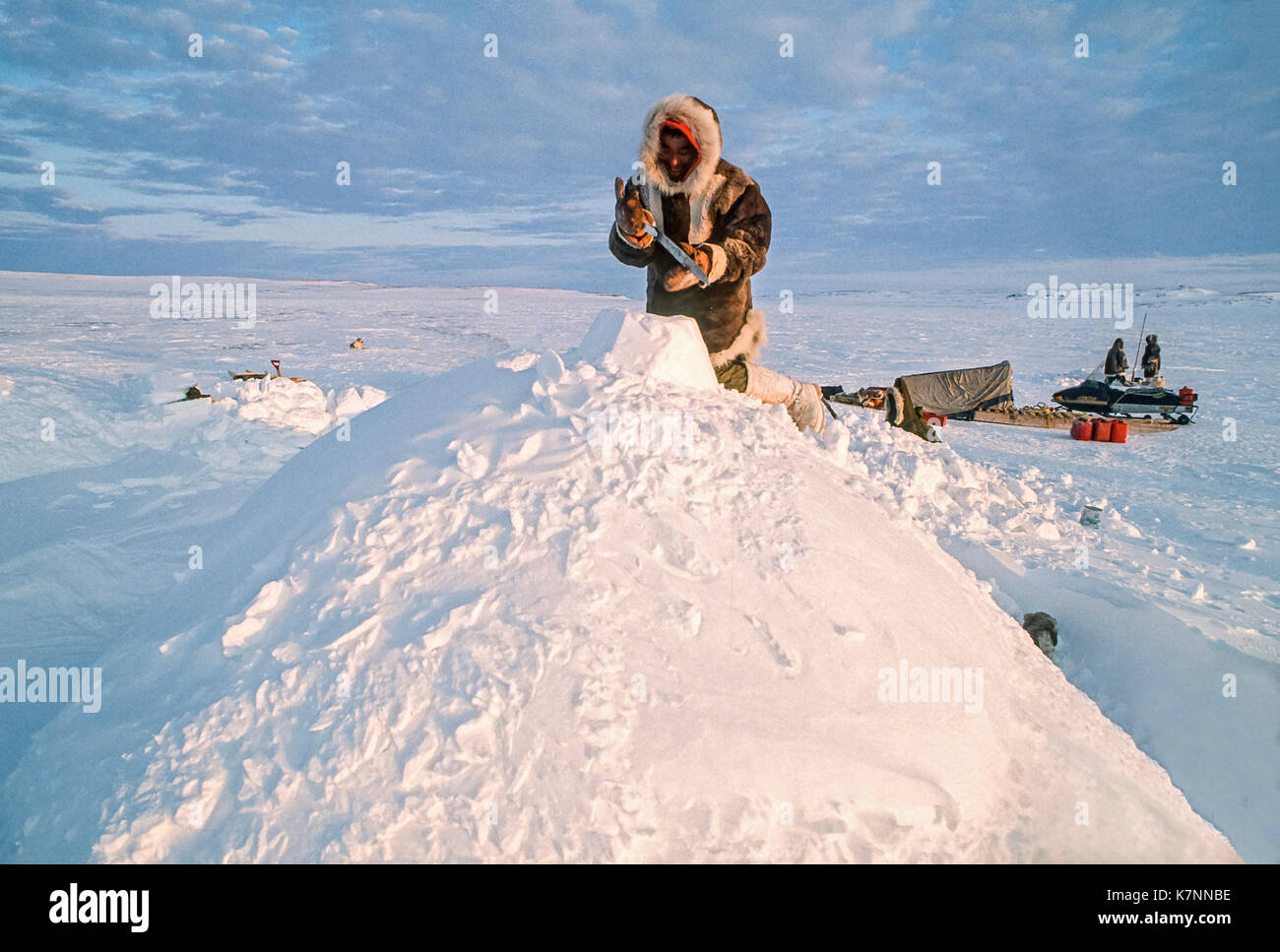 Inuit elder man, mid 60s, dressed in traditional caribou skin clothing ...