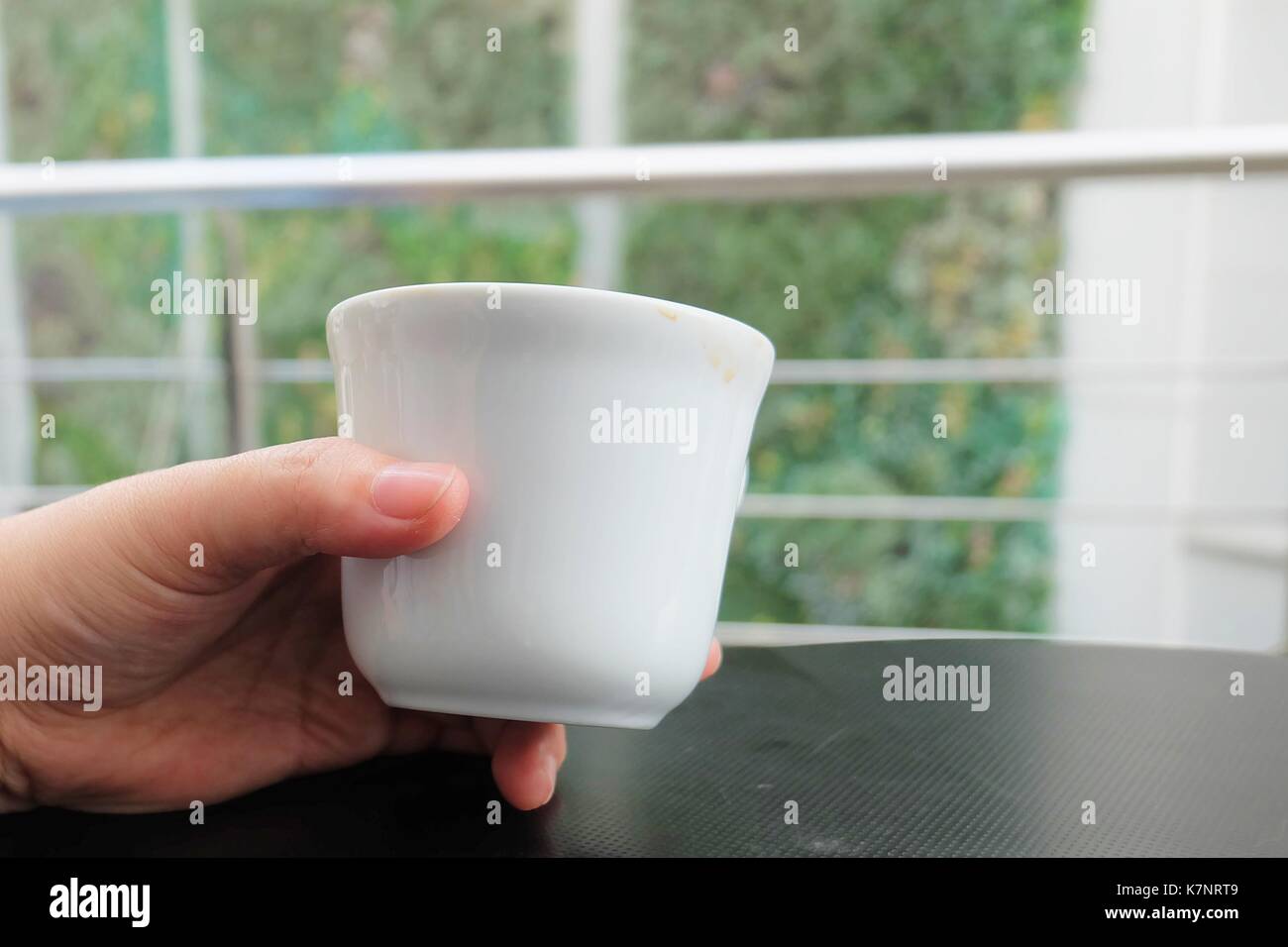 Cuisine and Food, Hand Holding An Empty Cup After Drinking Coffee on ...