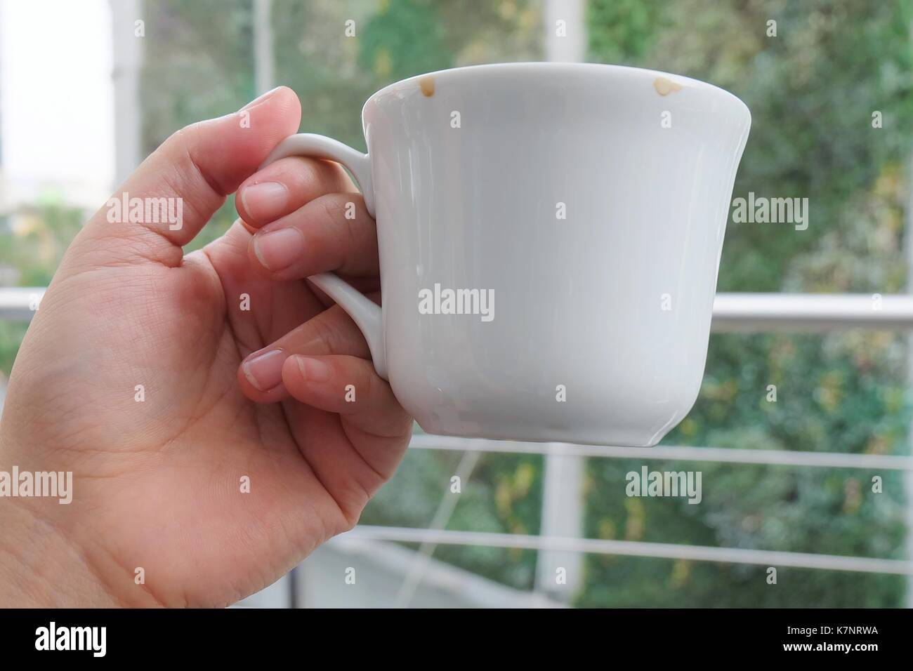 Cuisine and Food, Hand Holding An Empty Cup After Drinking Coffee on ...