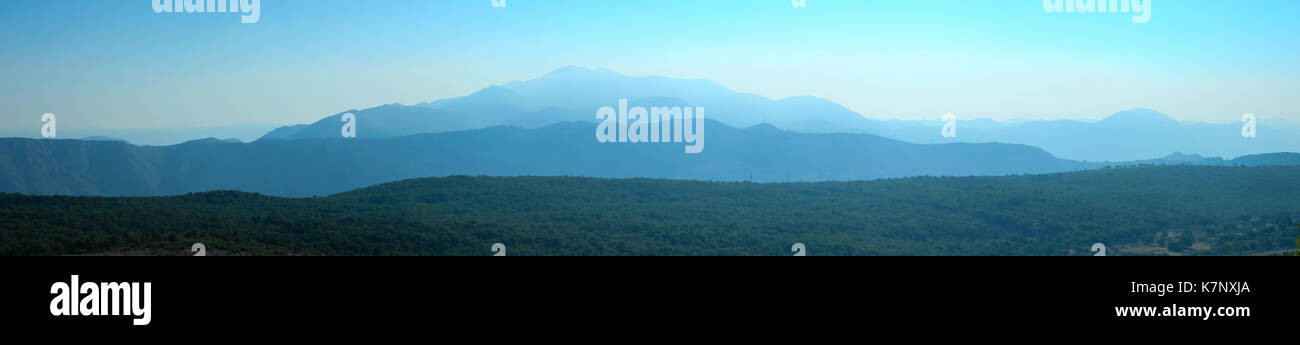 A panoramic view of Srd hill in the morning with a mountain in the ...