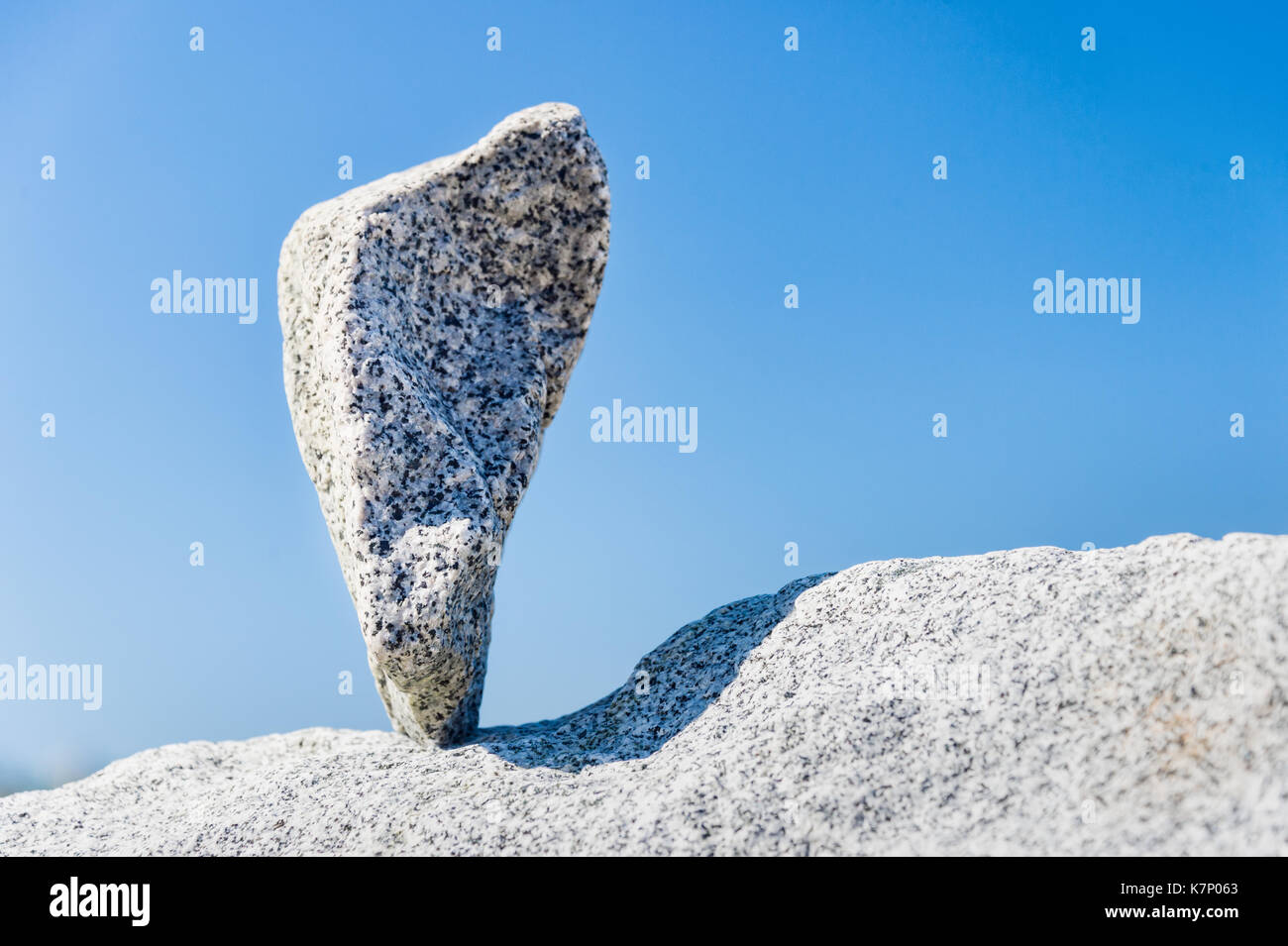 Triangular rock balanced on the tip in Vancouver rock stacking garden ...