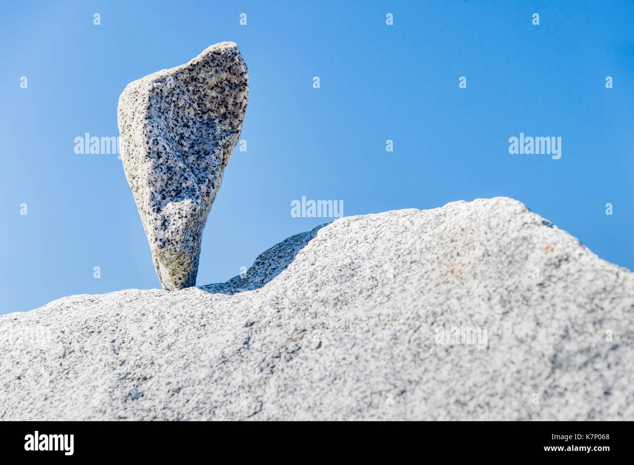Triangular rock balanced on the tip in Vancouver rock stacking garden ...