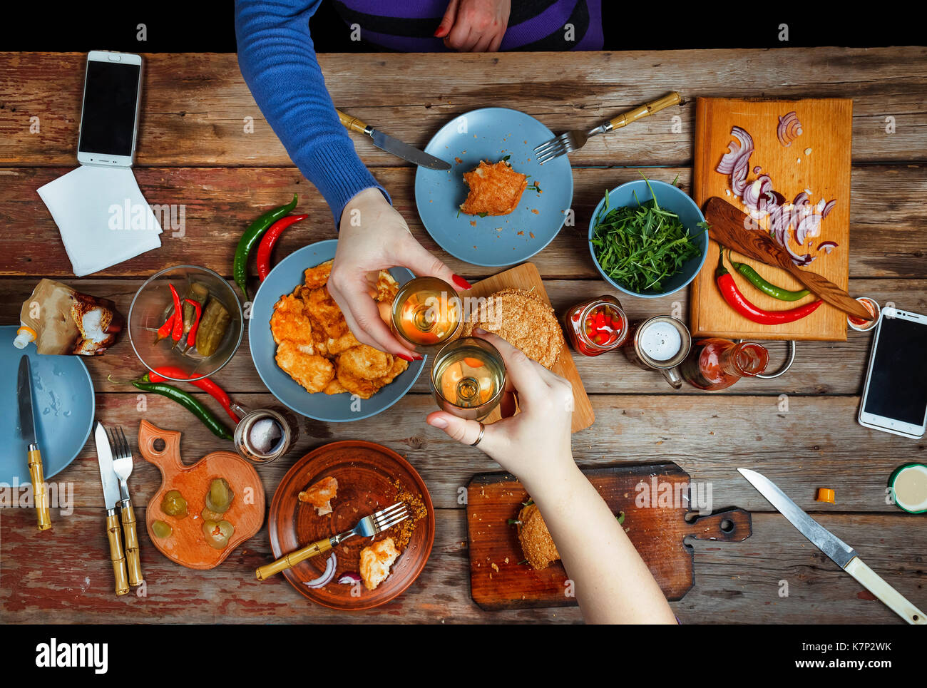 Meeting friends at the dinner table with American snacks and wine. Up ...