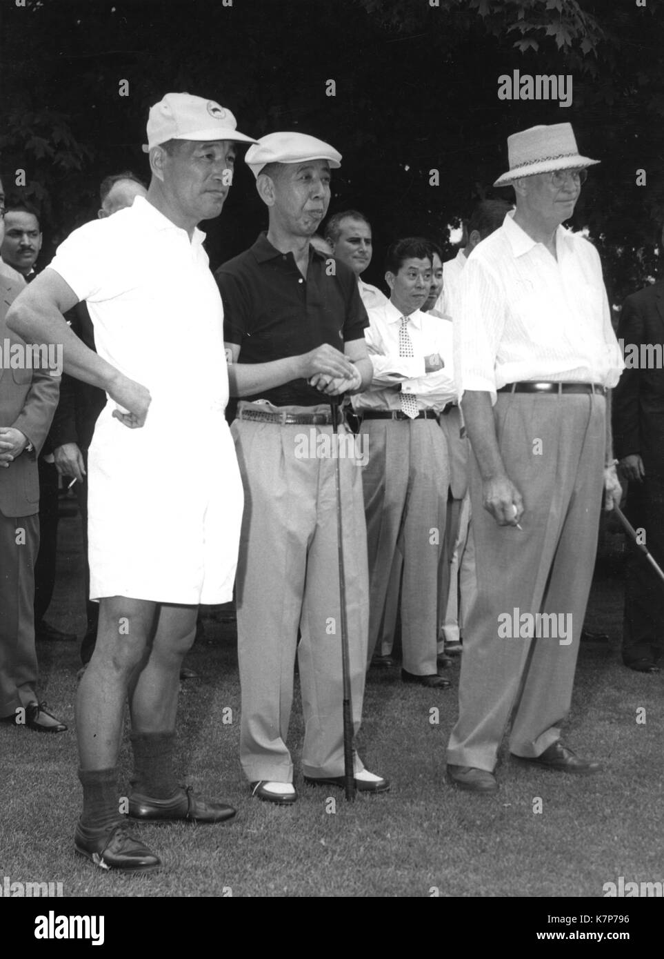 Prime Minister Nobusuke Kishi of Japan (center), on a visit to the ...