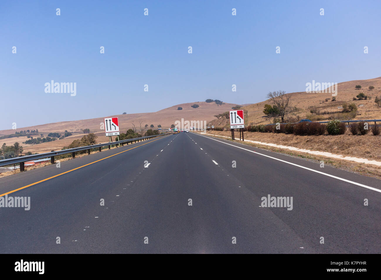 Drivers View travelling road highway with vehicles route through ...