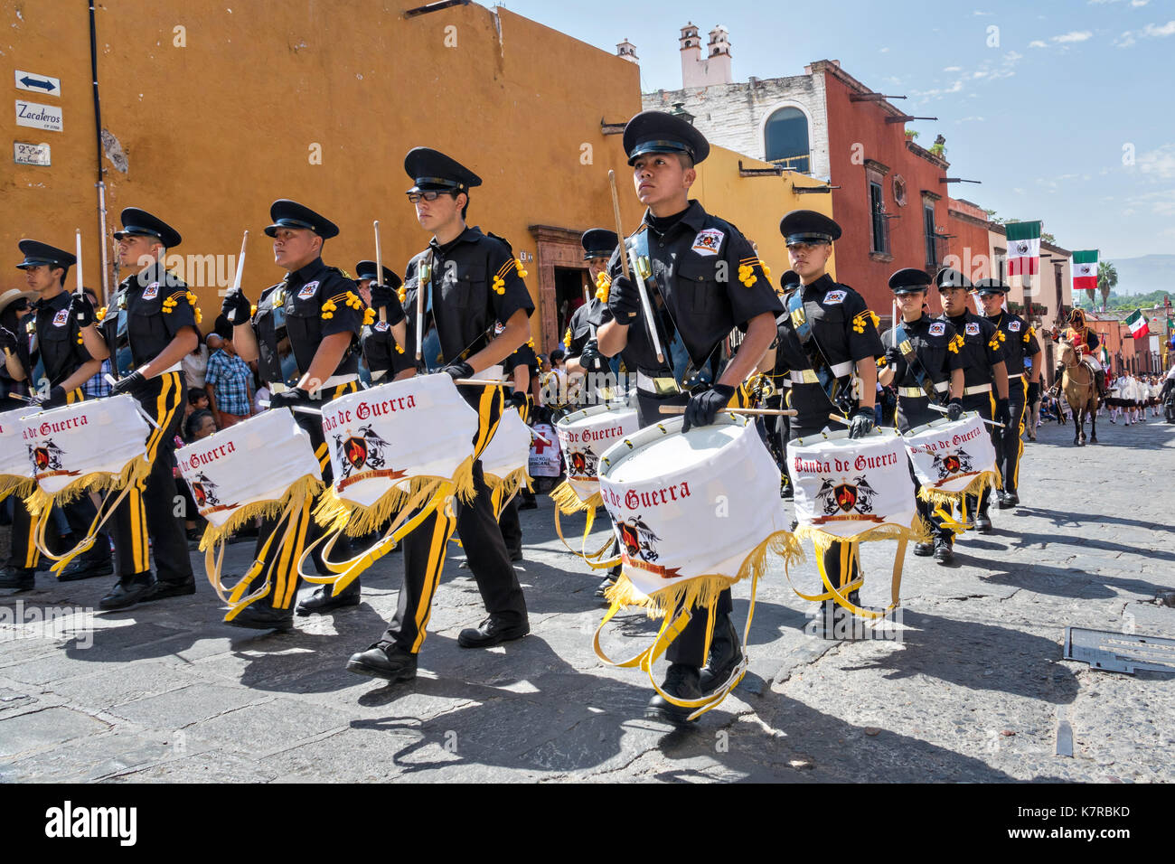 A police marching band parades through the historic during Mexican ...