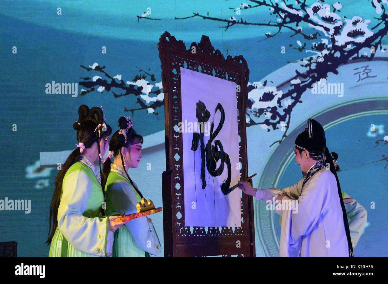 Enshi, China's Hubei Province. 17th Sep, 2017. Actors perform flower ...