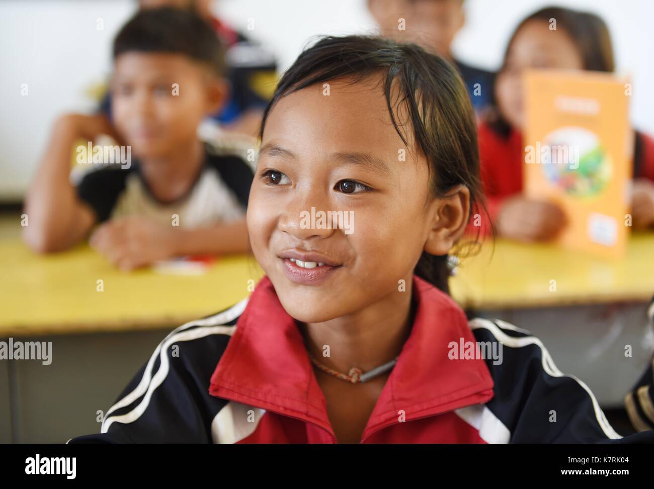 Menghai. 17th Sep, 2017. Students attend class inside a new classroom ...