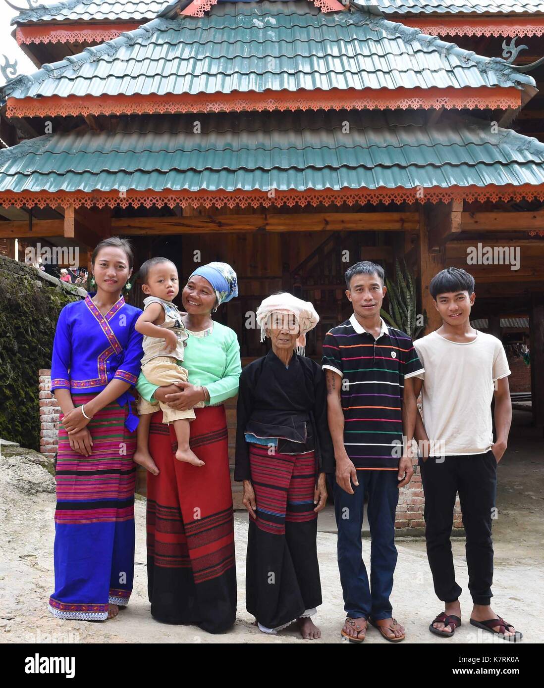 Menghai. 17th Sep, 2017. Yan Jianbing (2nd R) and his family pose for a ...