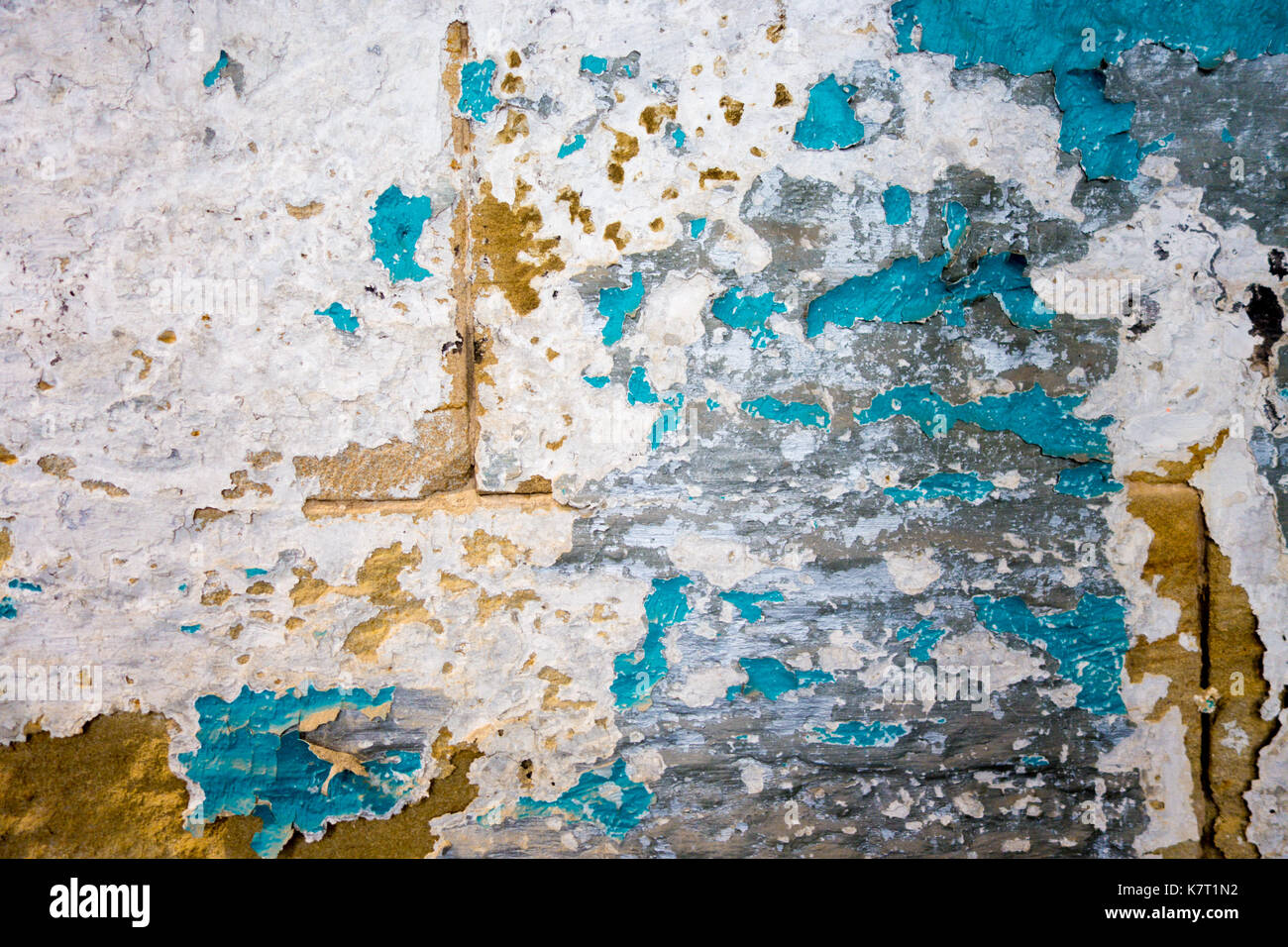 Colorful peeling paint on a stone wall Stock Photo - Alamy