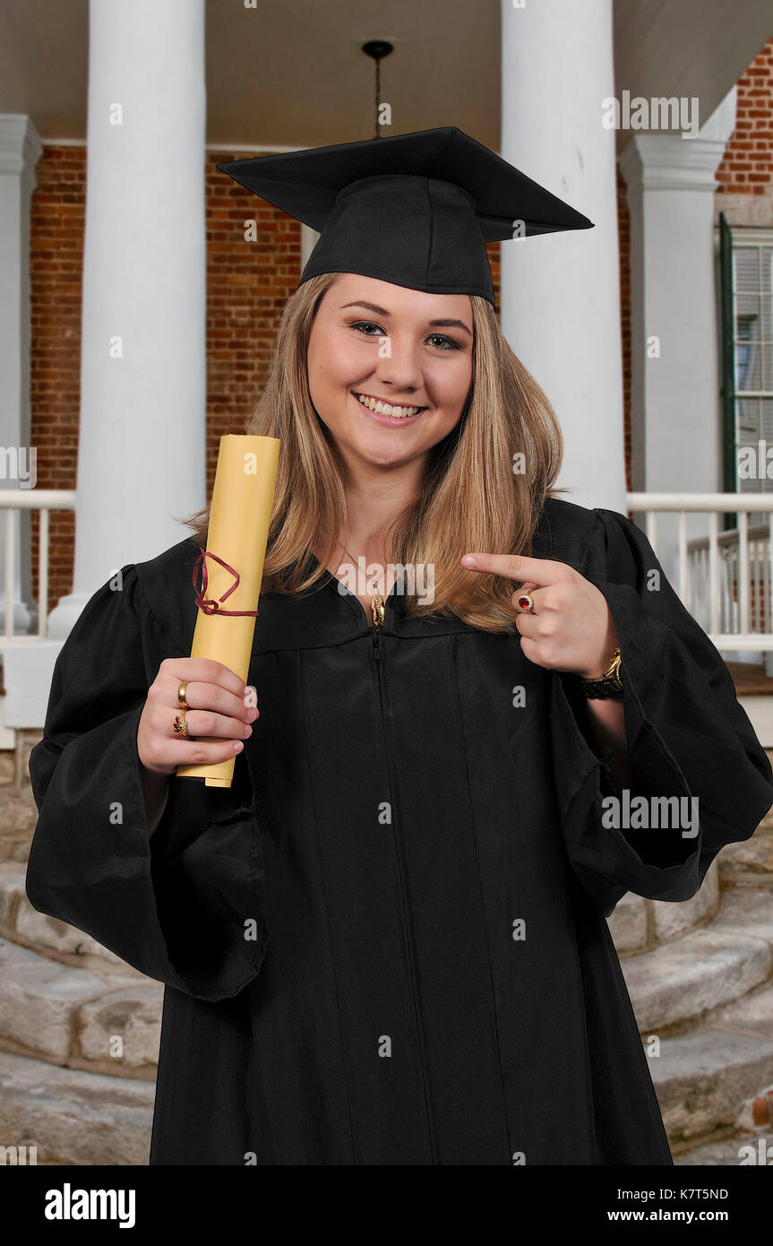 Young woman in her graduation robes Stock Photo - Alamy