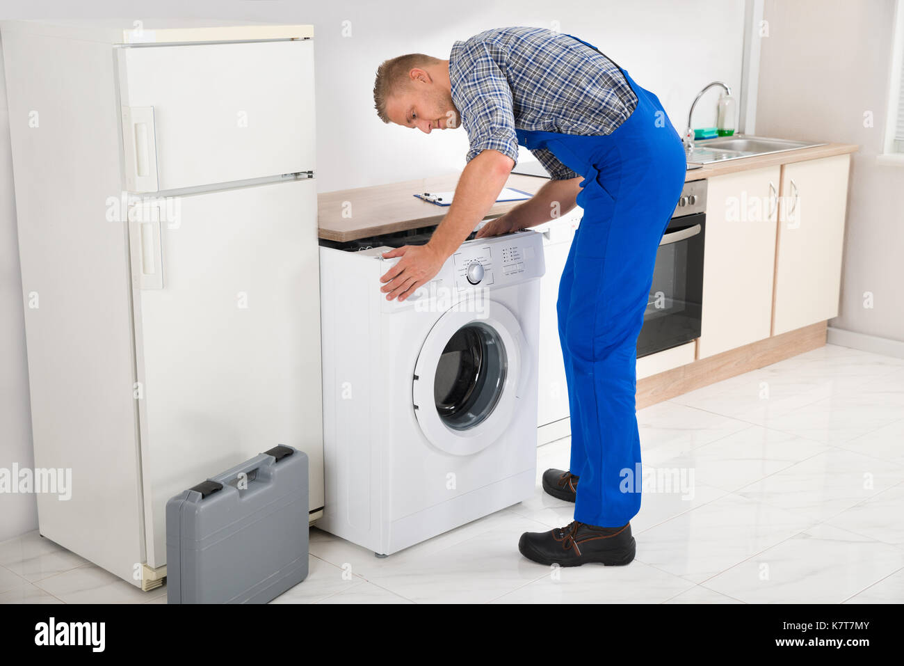 Repair man machine hi-res stock photography and images - Alamy