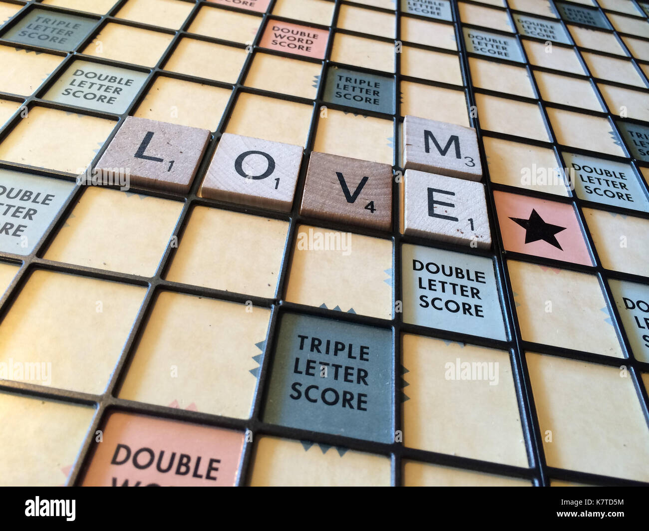 Spelling spell out with scrabble tiles hi-res stock photography and ...