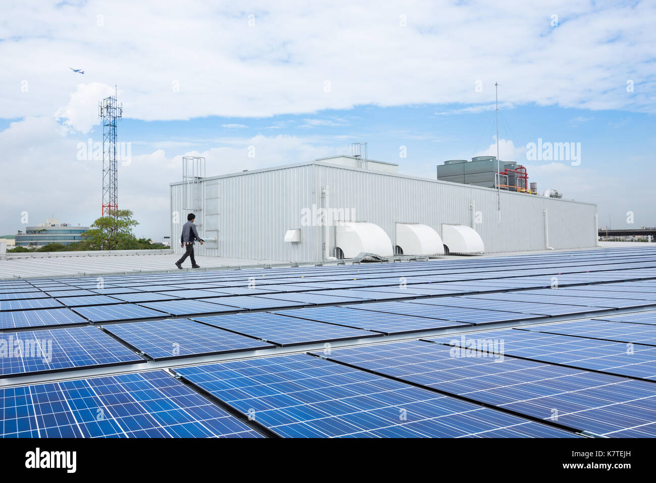 Solar panels on factory roof Stock Photo - Alamy