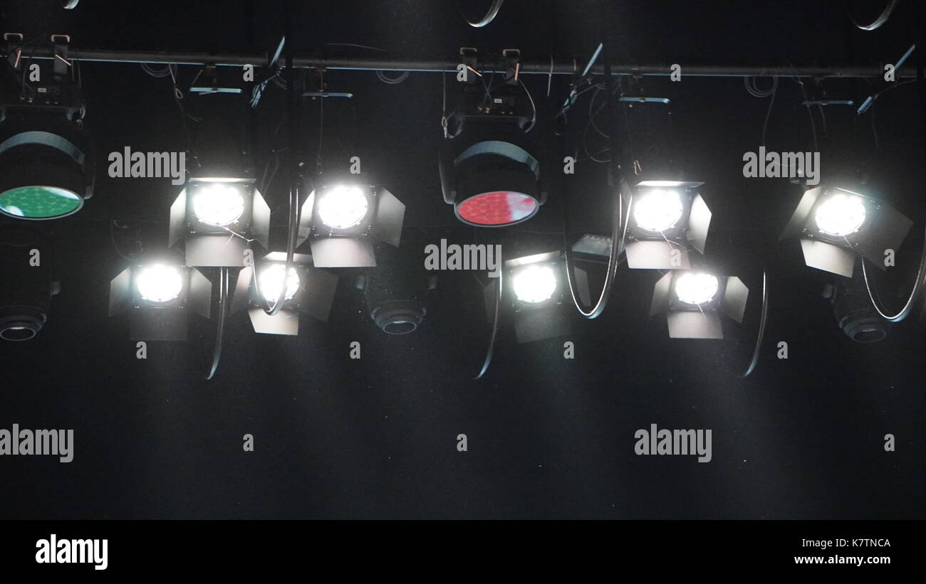 Bright floodlights attached to a steel frame. Horizontal view of yellow ...