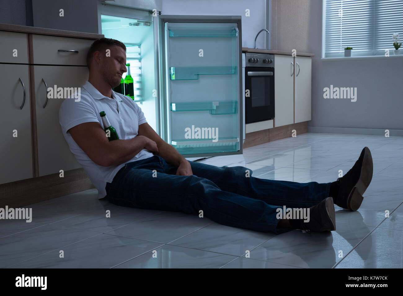 Man sleeping beer bottle hi-res stock photography and images - Alamy