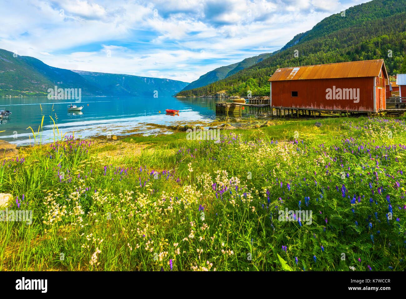 bay with wooden boathouses of Solvorn at the Lustrafjorden ...
