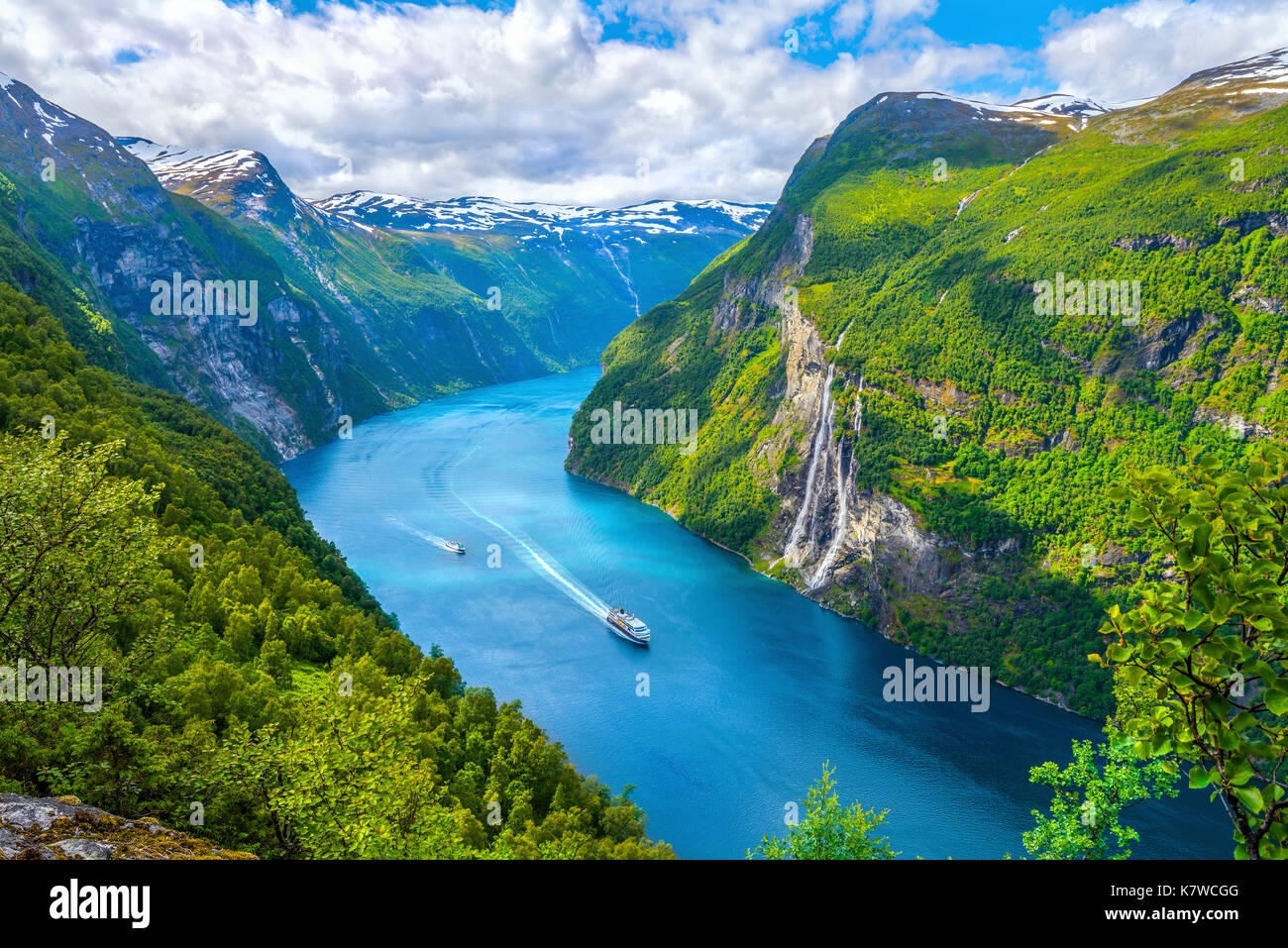 cruise ship of Hurtigruten and the ferry passing Seven Sisters ...